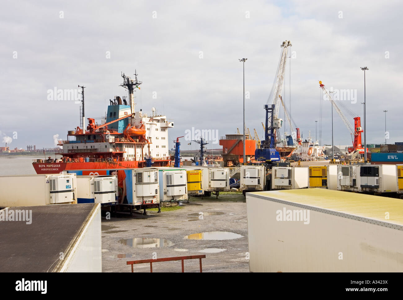 Cargo ships unloading at container dock facilities at the port of ...