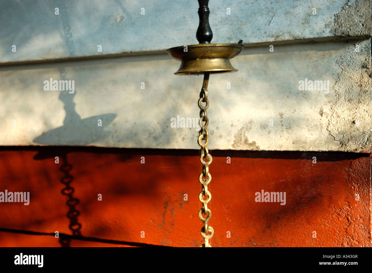 REFLECTION OF KERALA HANGING LAMP ON WOODEN WALL Stock Photo - Alamy