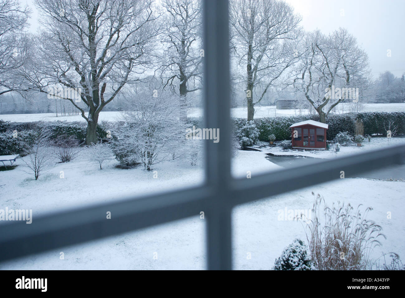 View from bedroom window on the first morning of snowfall Stock Photo ...