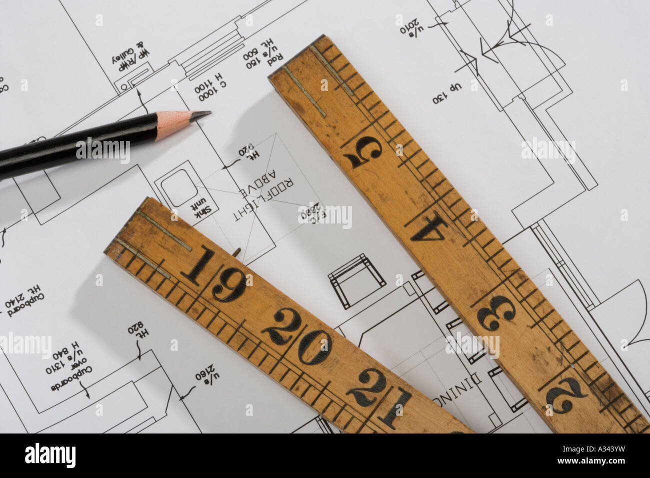 Tape measure and pencil on Architects technical drawings Stock Photo ...