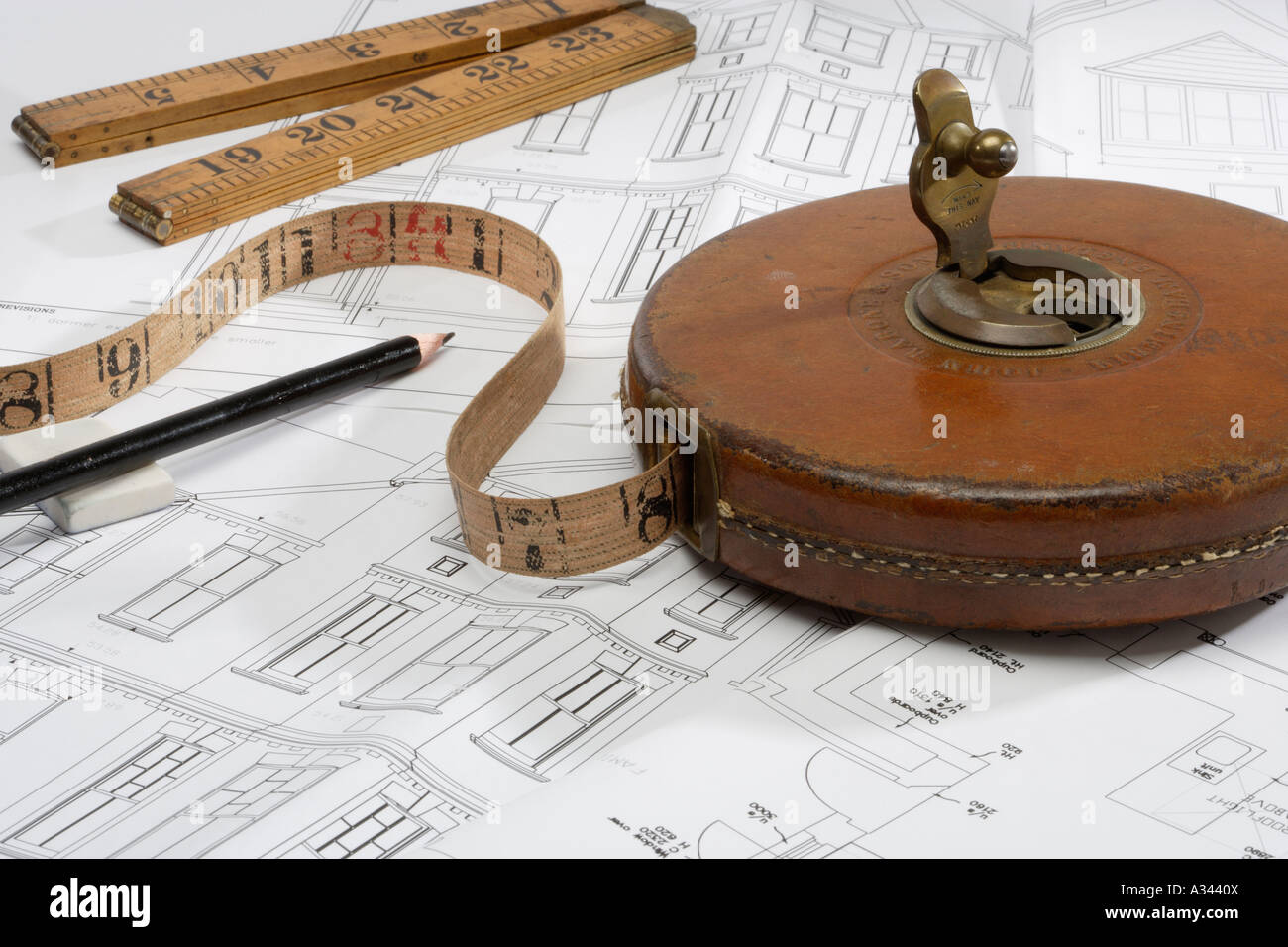 Tape measure and pencil on Architects technical drawings Stock Photo ...