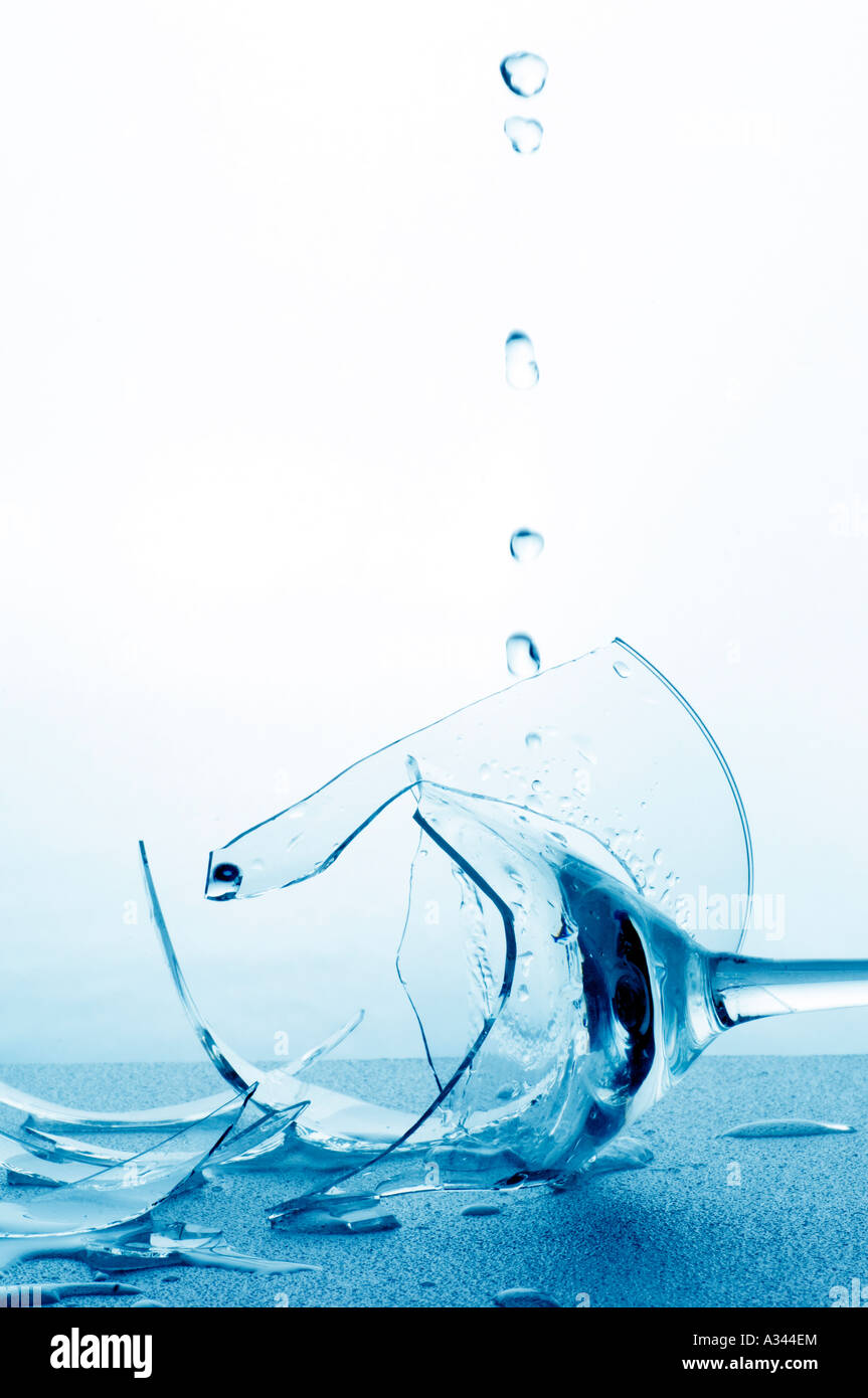Drops of water falling on a broken glass Stock Photo - Alamy