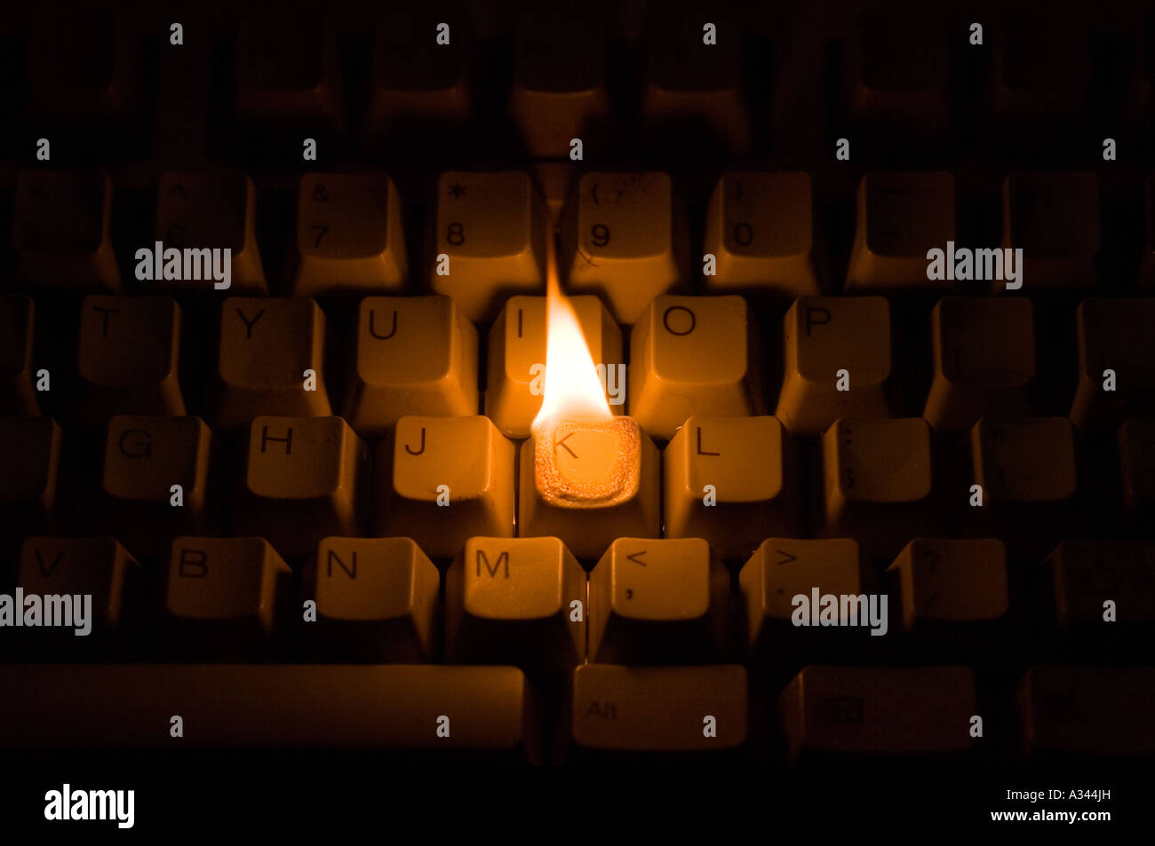 Conceptual Image of only the letter K burning in the computer keyboard ...