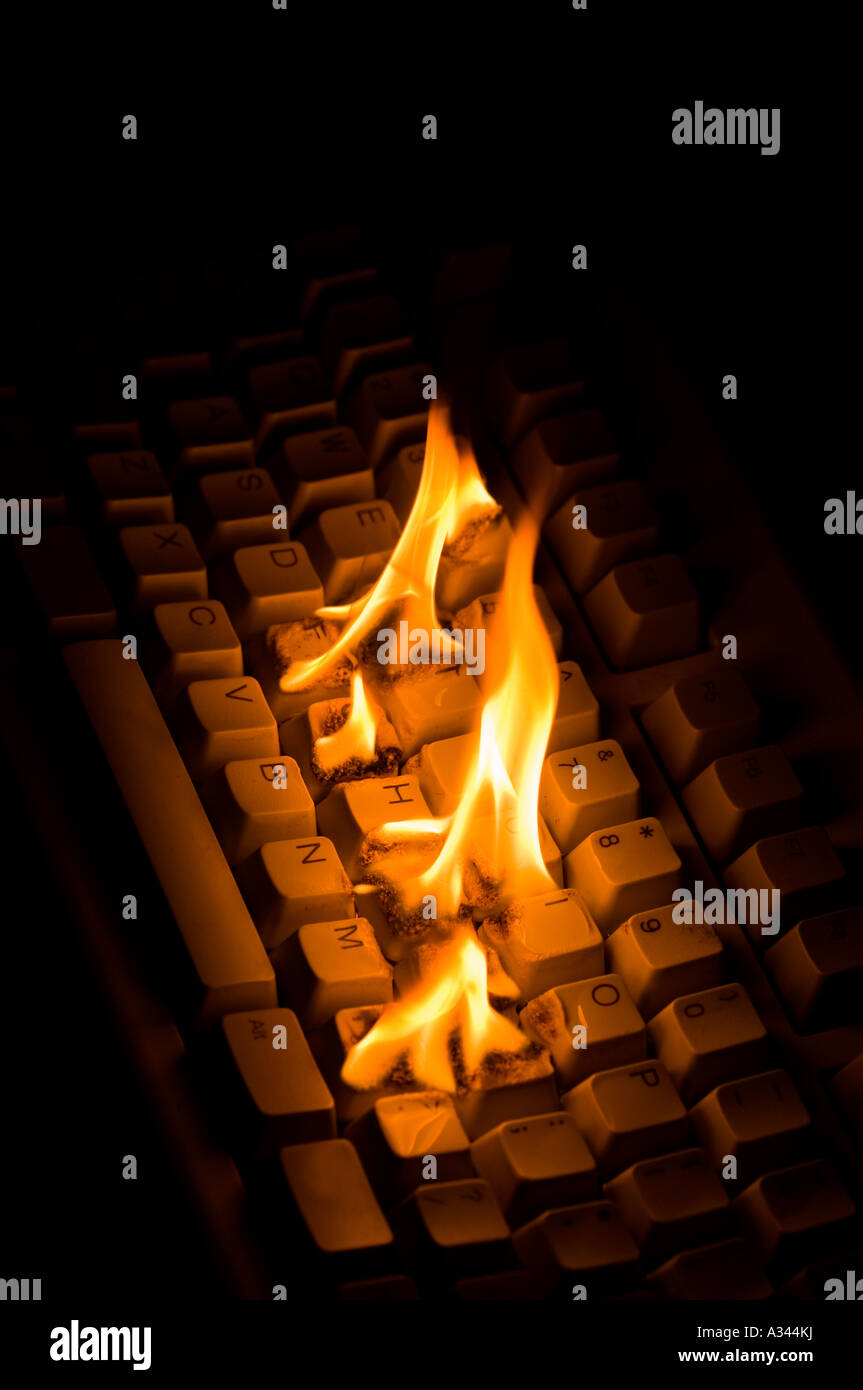 Computer Keyboard burning indoors Stock Photo - Alamy