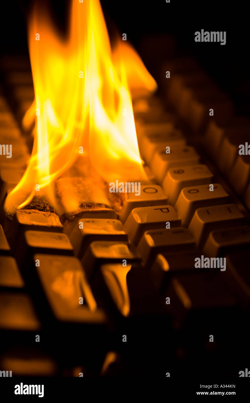 Close Up of a computer keyboard on fire Stock Photo - Alamy