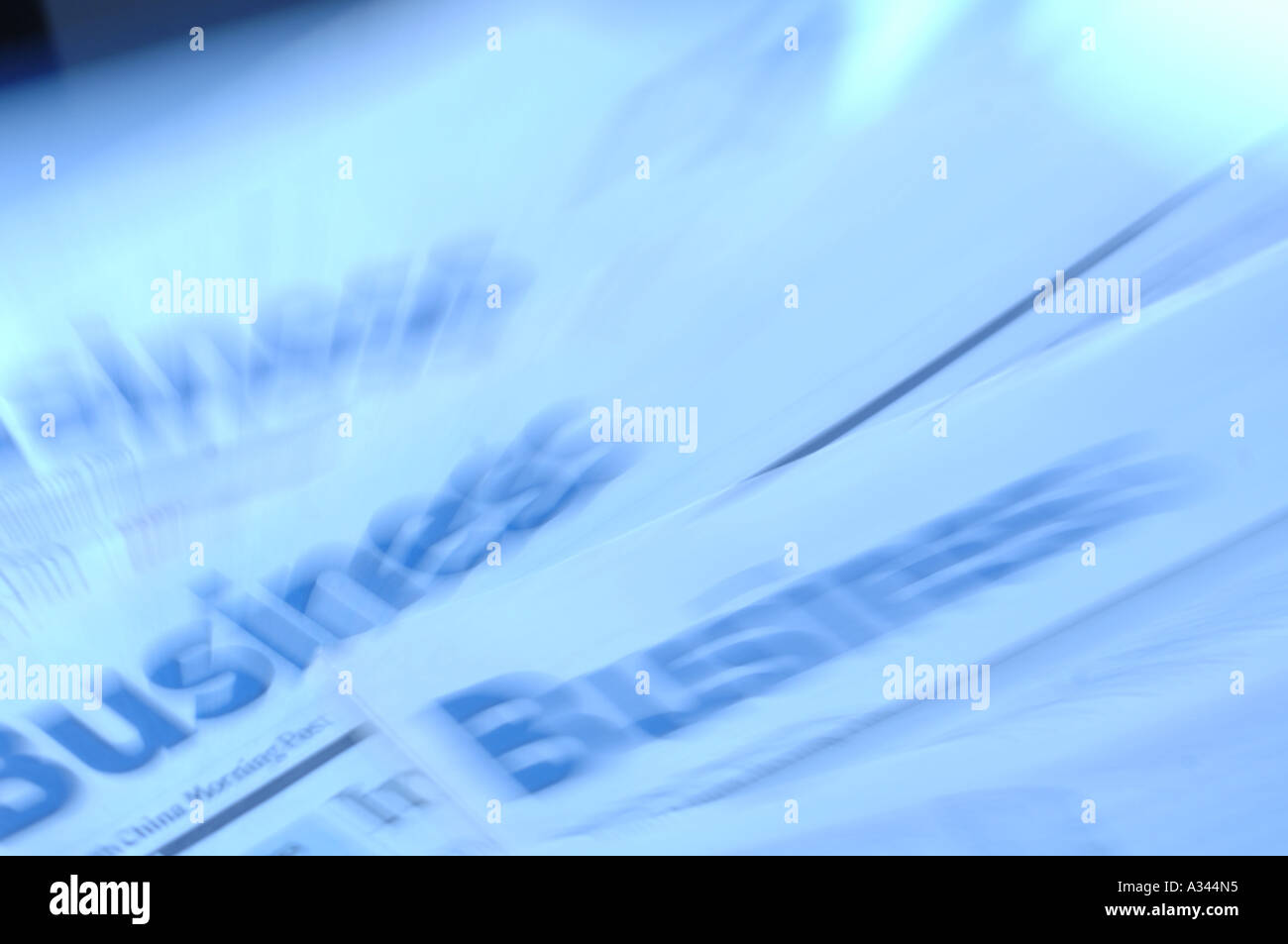 business newspaper, blurred, zooming Stock Photo - Alamy