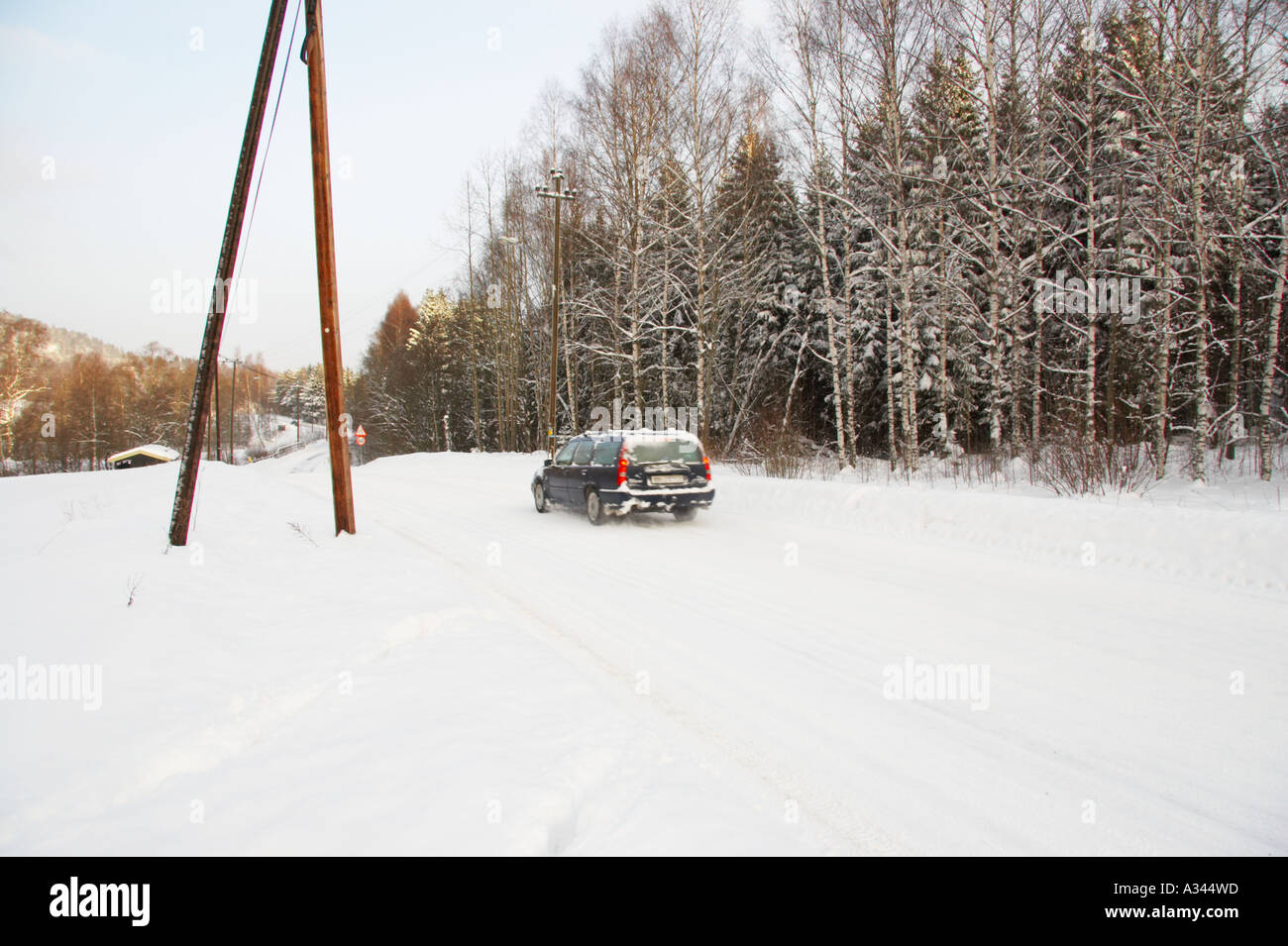 Norway, Oslo, Oslo City. A car driving along a road after a heavy ...