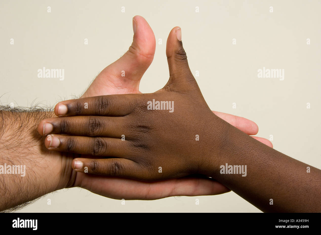 Ethnic Diversity hands helping hand Stock Photo - Alamy