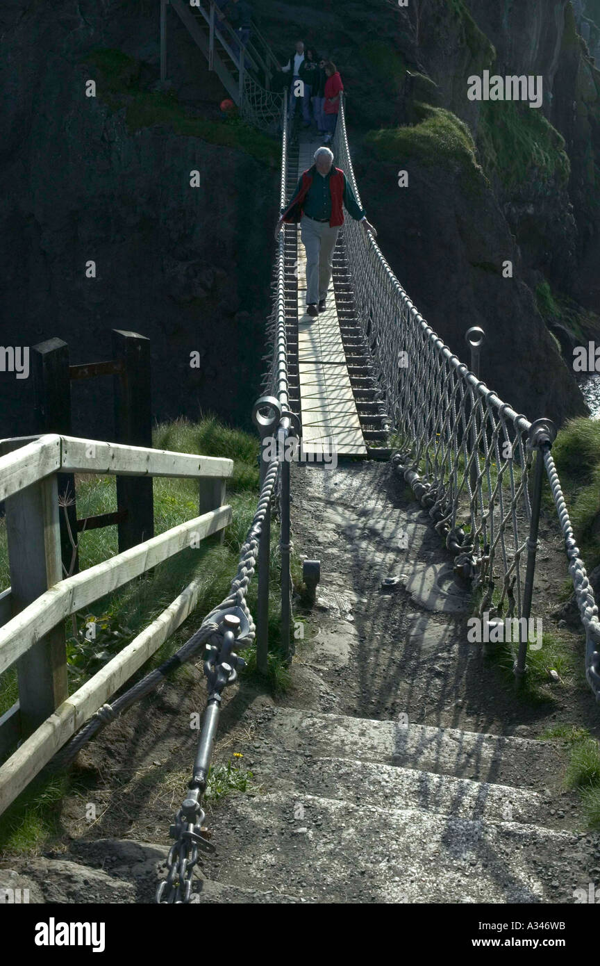 Walking the Carrick-a-Rede rope bridge Co Antrim Northern Ireland Stock ...