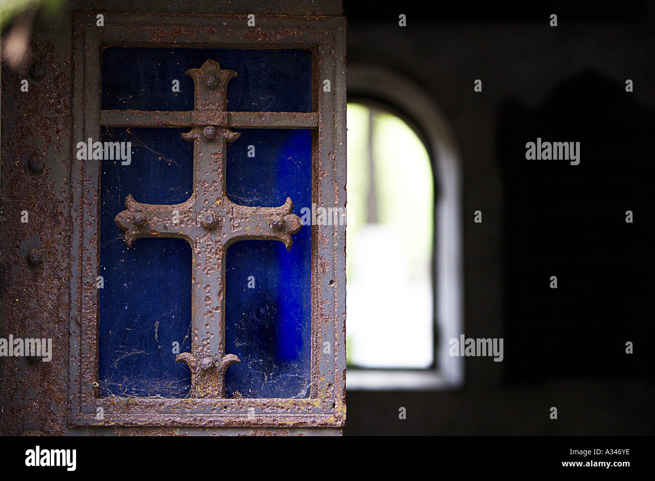 Close up of a christian cross on a stained blue glass door Stock Photo ...