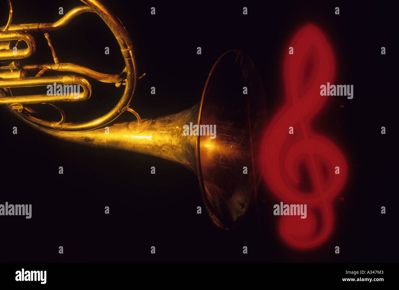 An antique wind instrument is shown with a glowing red g-cleff implying ...