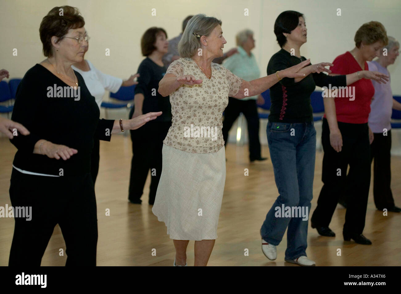 Senior citizens and pensioners dance Latin American line dancing ...