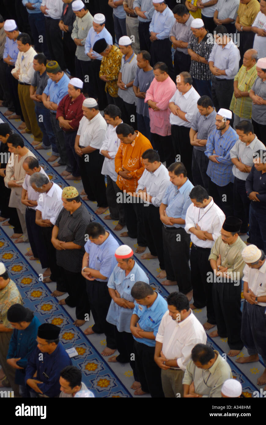 Muslim men at Friday prayer in the National Mosque, Kuala Lumpur ...