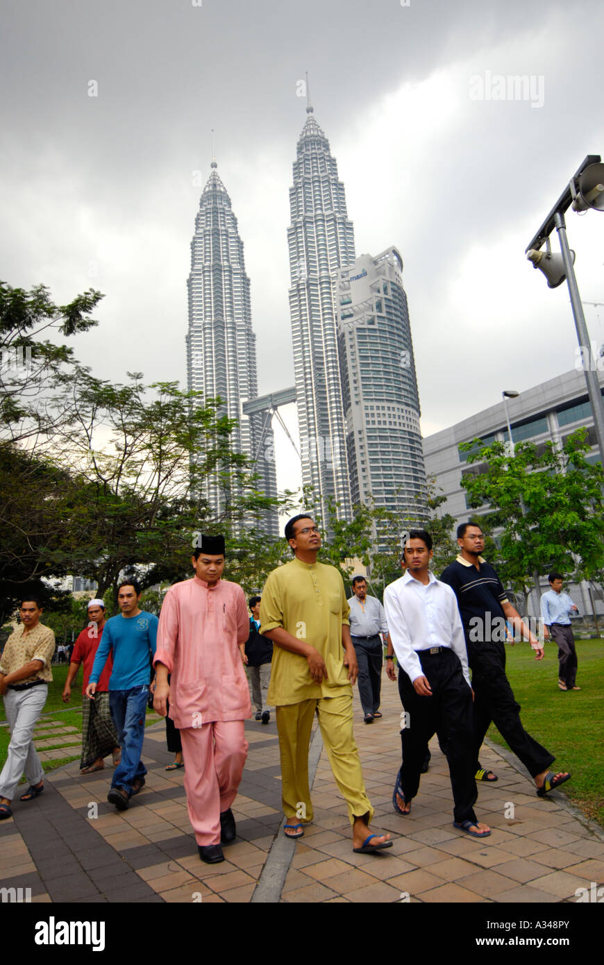Muslim men walking to Friday prayer at the Asy Syakirin Mosque near the ...