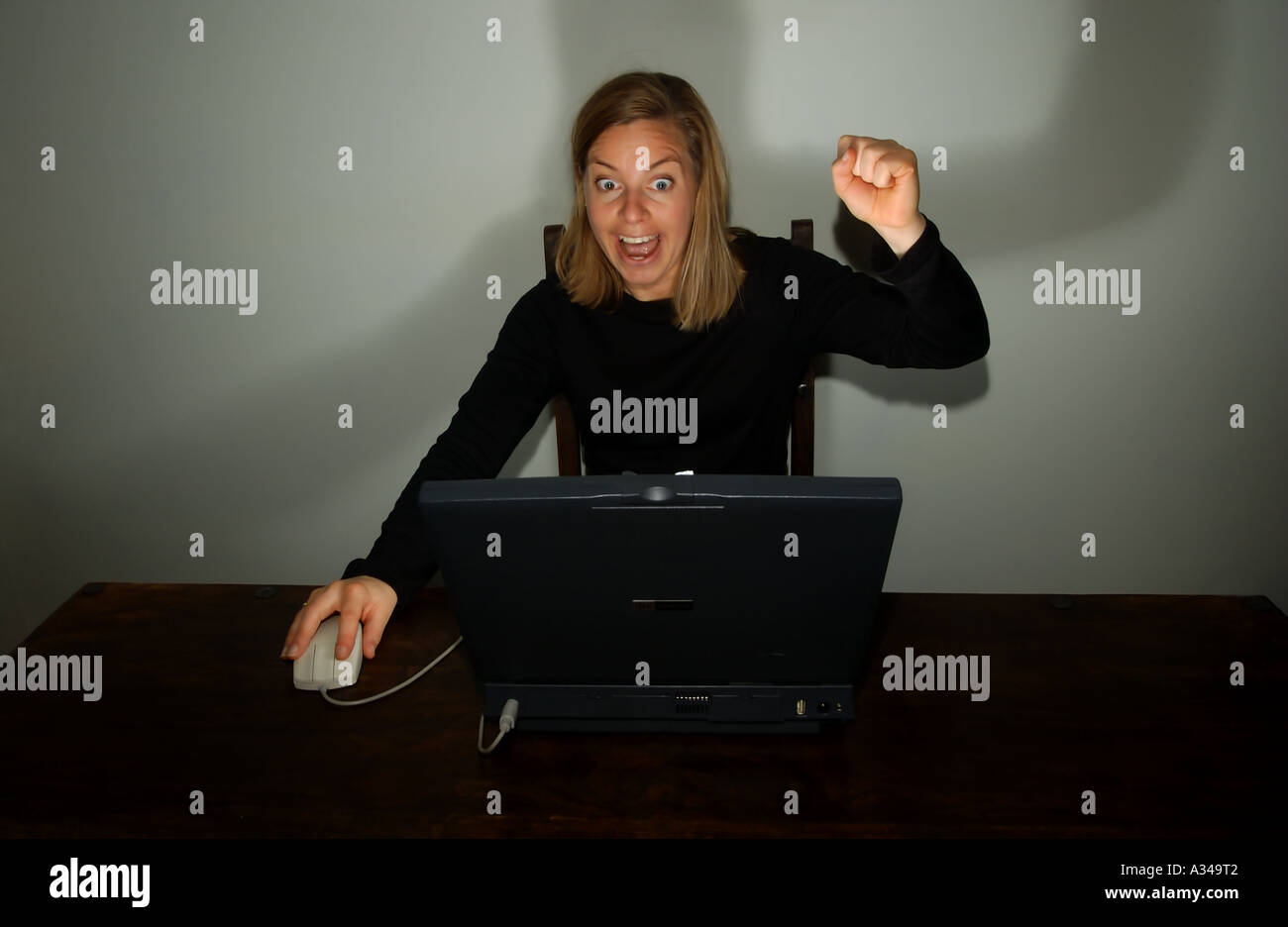 Woman pulling face and desk hi-res stock photography and images - Alamy