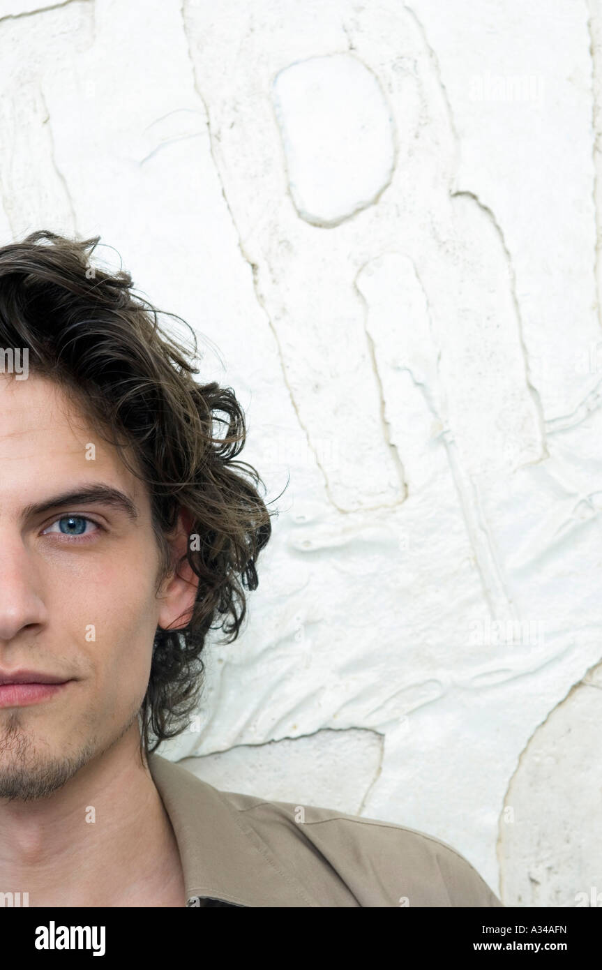 Portrait of a young man looking at the camera Stock Photo - Alamy