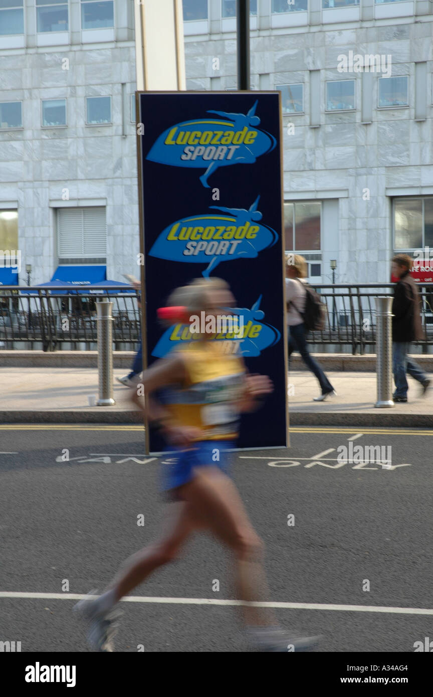 Person Running Past Lucozade Sign Stock Photo - Alamy