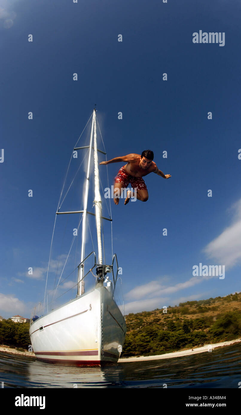 Male diving from boat hi-res stock photography and images - Alamy