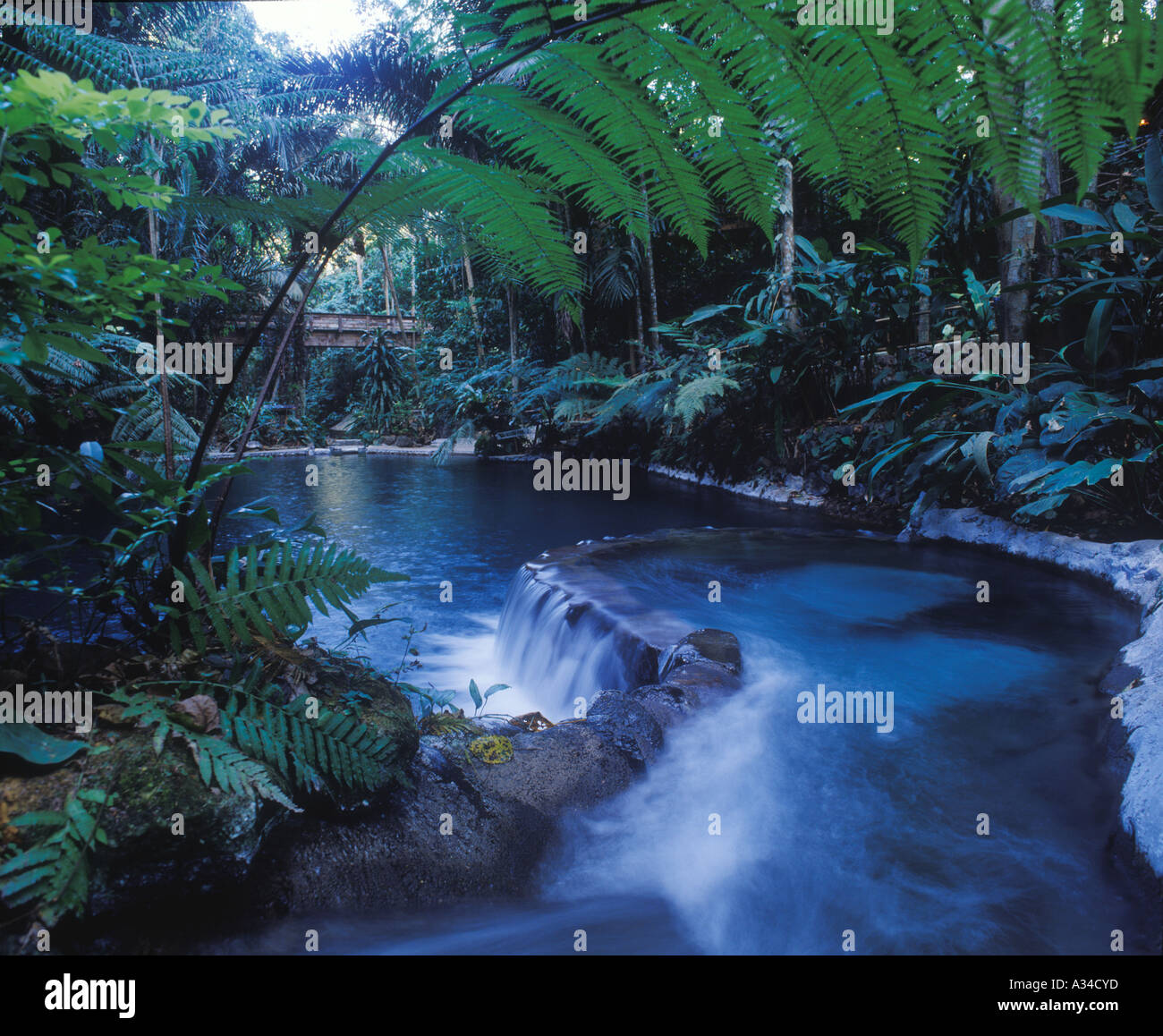 A natural pond is created as water cascades from one level to another ...