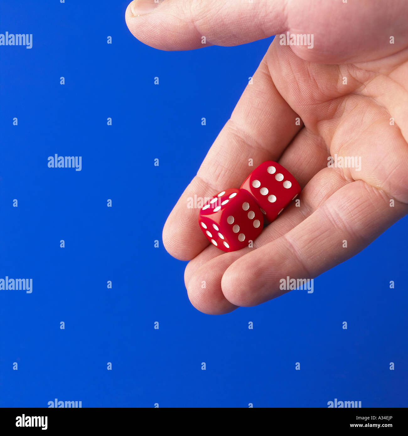 two dice with six on all sides in hand about to be rolled Stock Photo ...