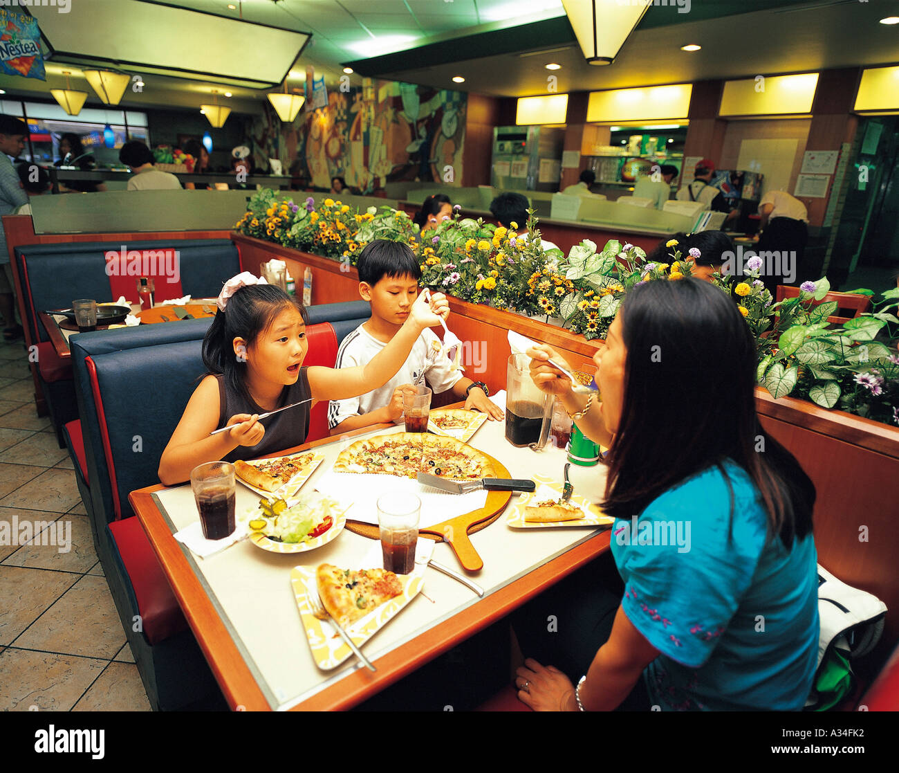 Family Eating At Fast Food Restaurant