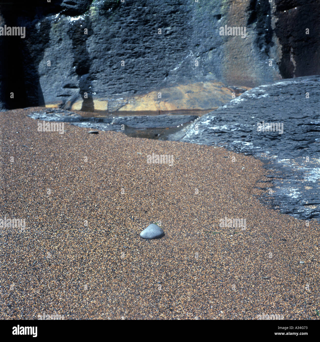 Beach pebble and rock formation in beach sand Saltwick Bay North ...