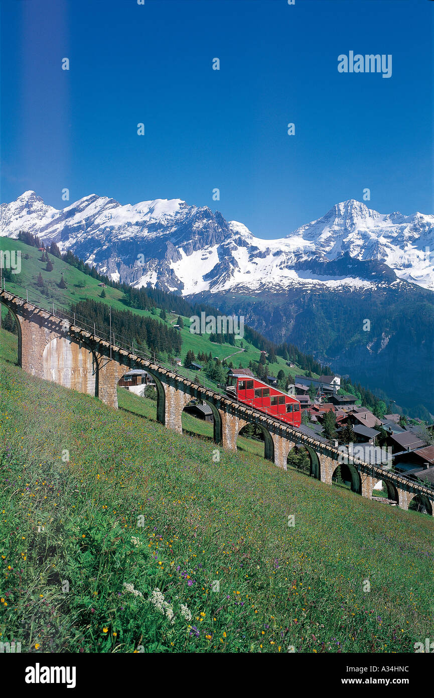 A train along the steep hill of the Alps Stock Photo - Alamy