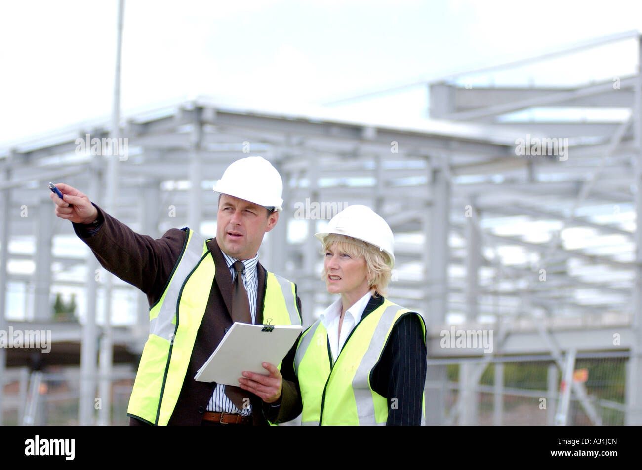 Royalty free photograph of British architects surveying building site ...