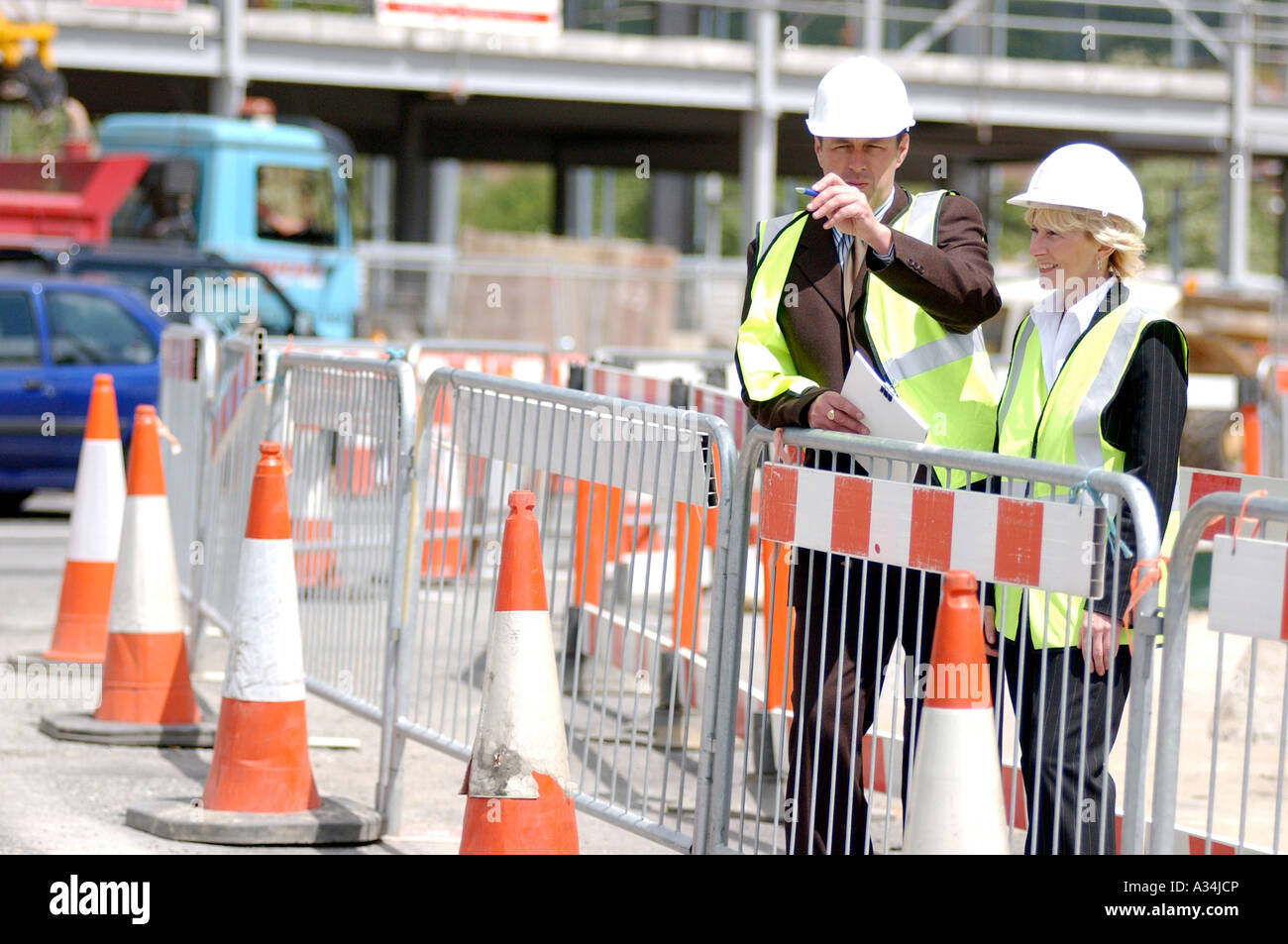 Royalty free photograph of British architect surveying building site in ...