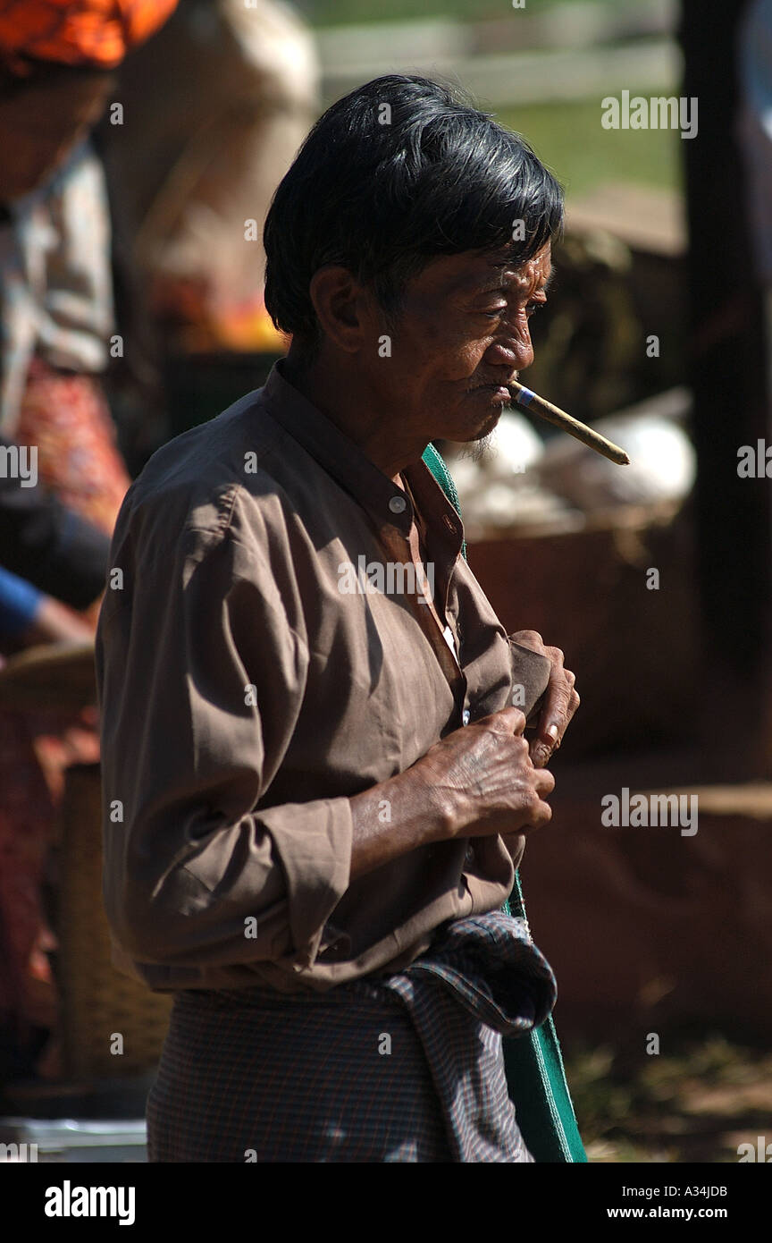 man smoking cigar at Khaundaign market Inle Lake Burma Myanmar Stock ...
