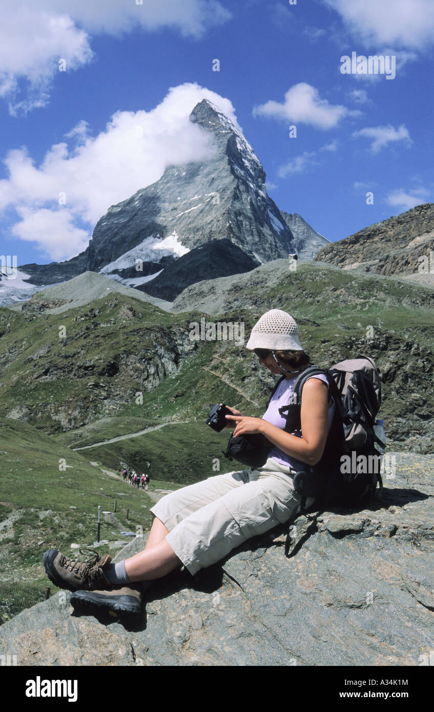 Woman traveler in mountains Swiss Alps Stock Photo - Alamy
