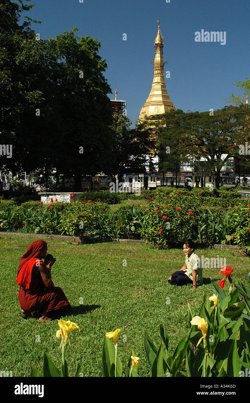 monk and young girl Sule Pagoda Maha Bandoola Park Yangon Burma Myanmar ...