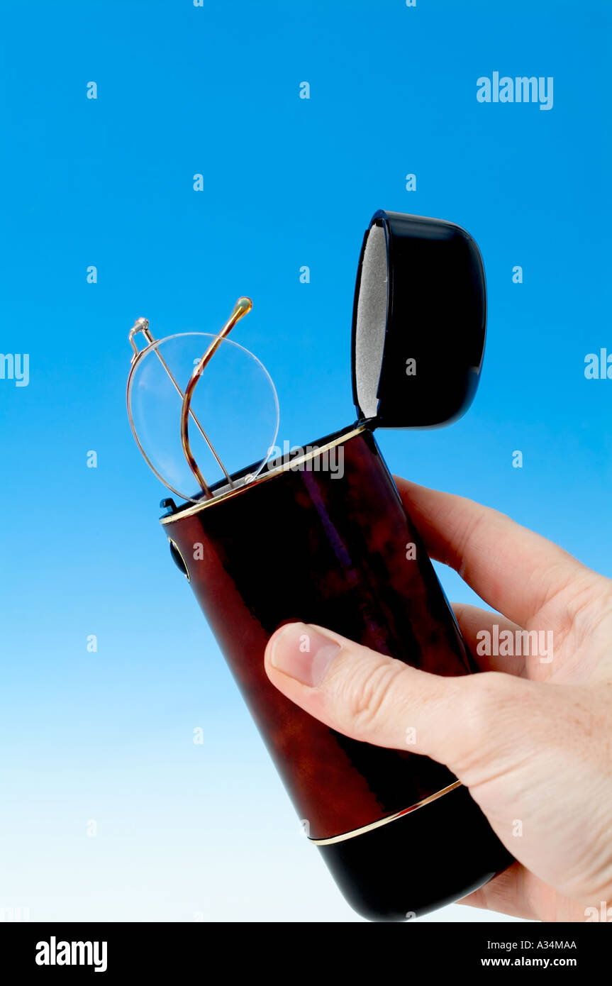 Hand holding a spectacles case Stock Photo - Alamy