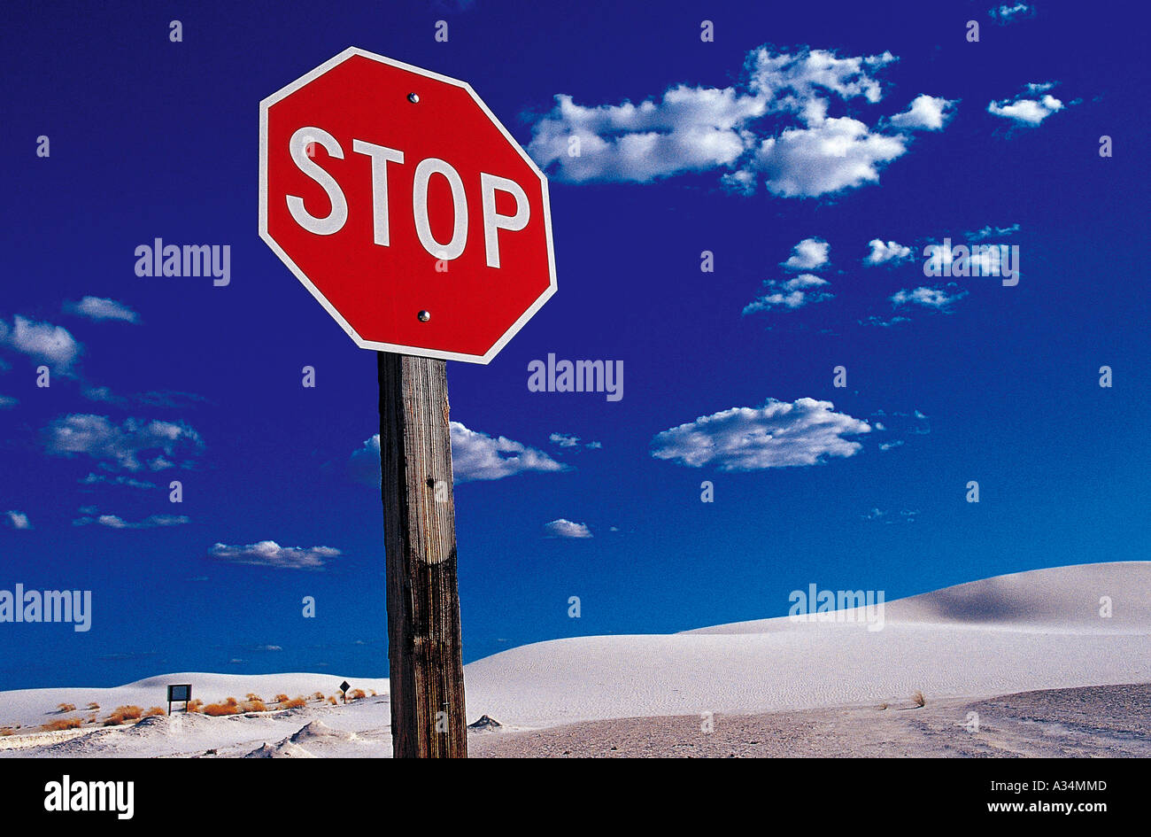 A stop sign with white sand and clear sky Stock Photo - Alamy