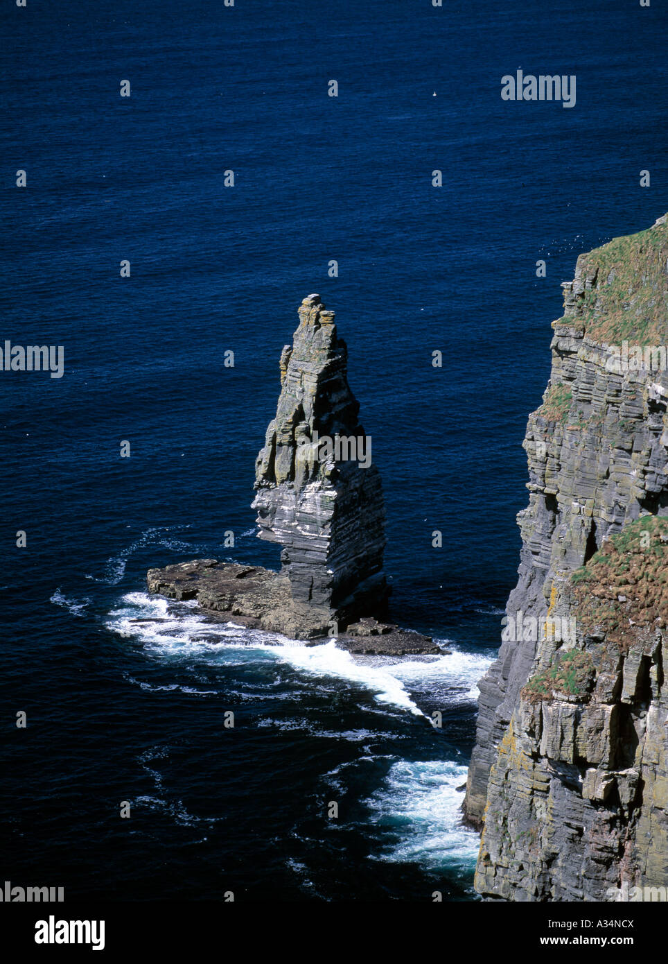 tall sea stack coming upright out of the atlantic seabed, constant ...