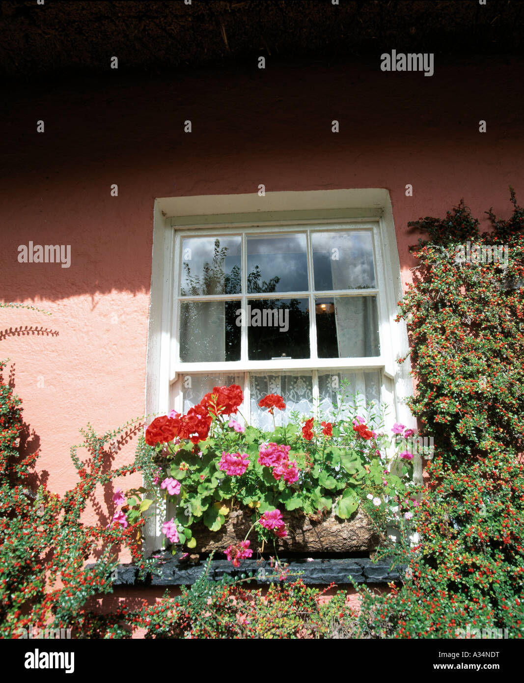 glass window of an old farmhouse decorated with flowers Stock Photo - Alamy