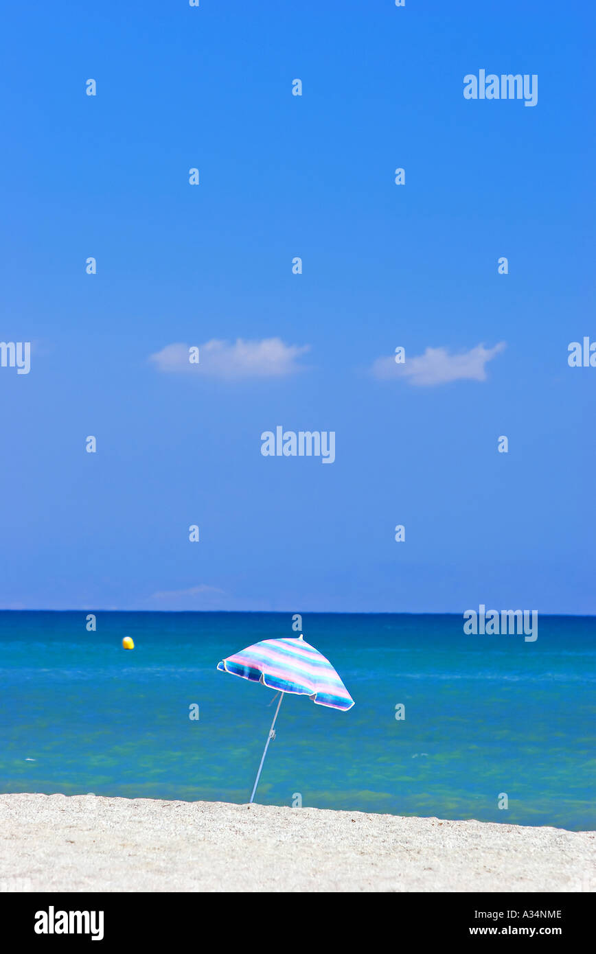 Single parasol on deserted, sunny, sandy beach in Spain Stock Photo - Alamy