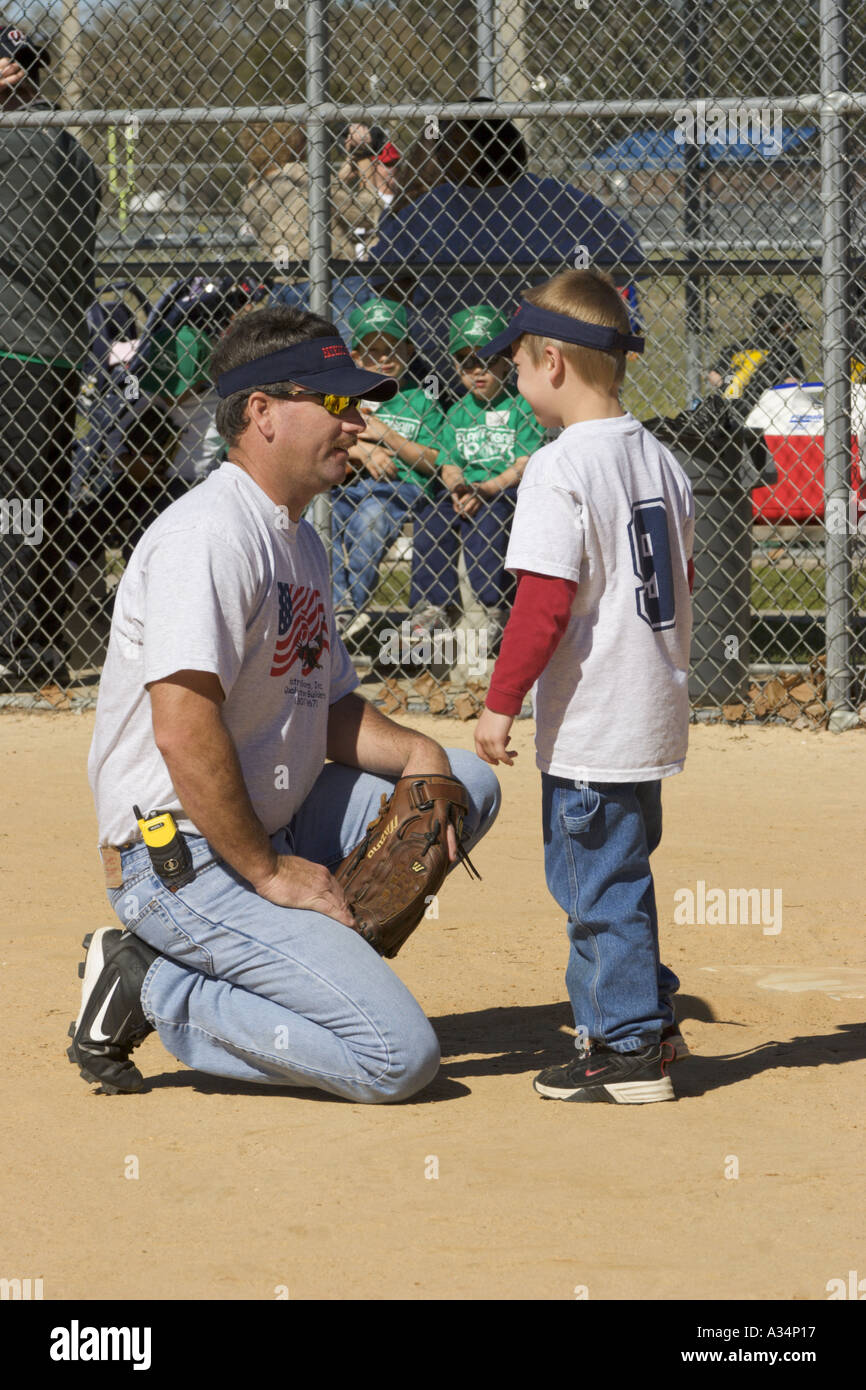 Coach gives words of encouragement to Little League baseball player ...