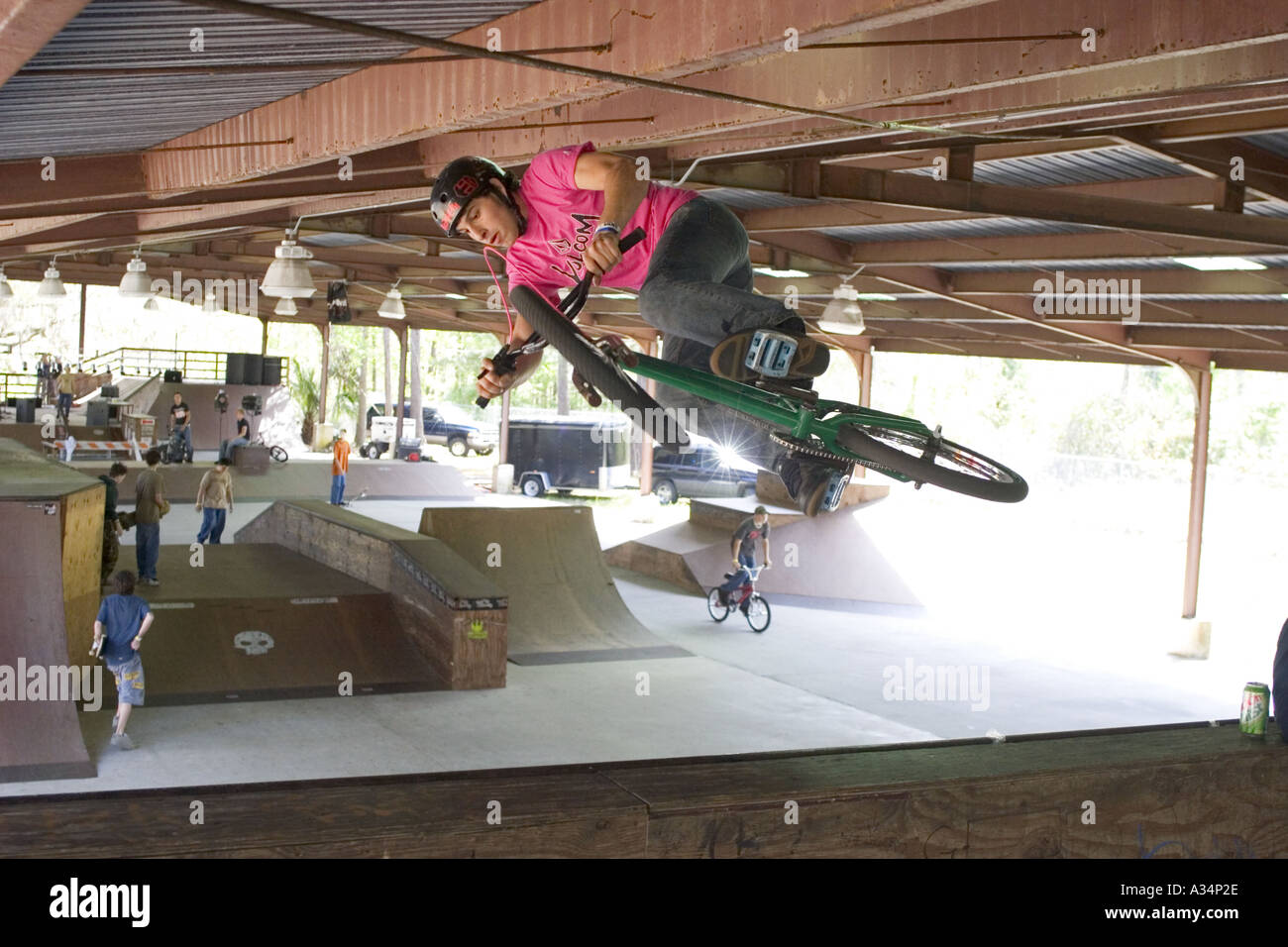 BMX bicycle rider performing maneuvers in BMX park in Ocala Florida USA ...