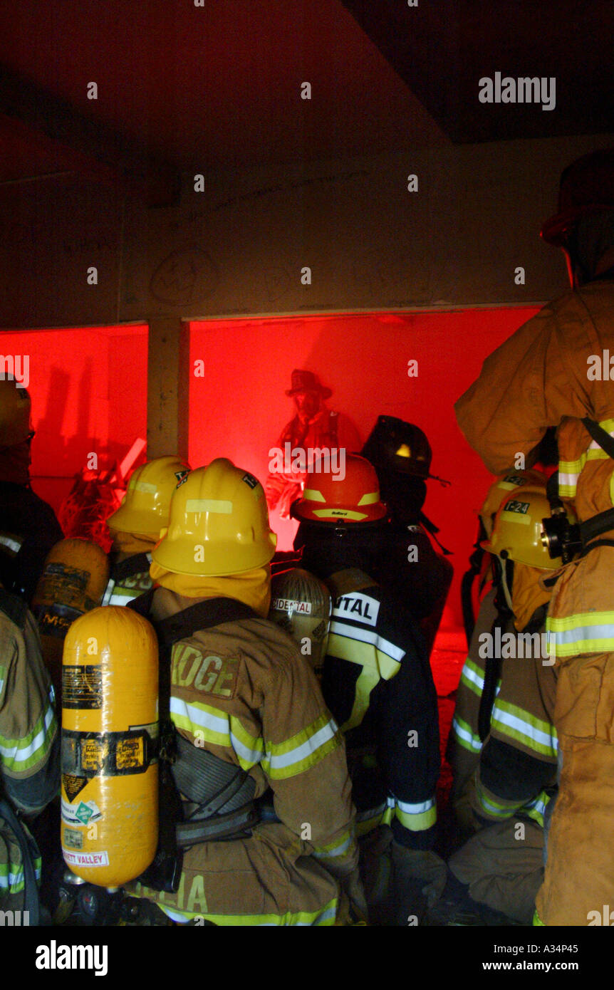 Firefighter trainees fight a structure fire during a training exercise ...