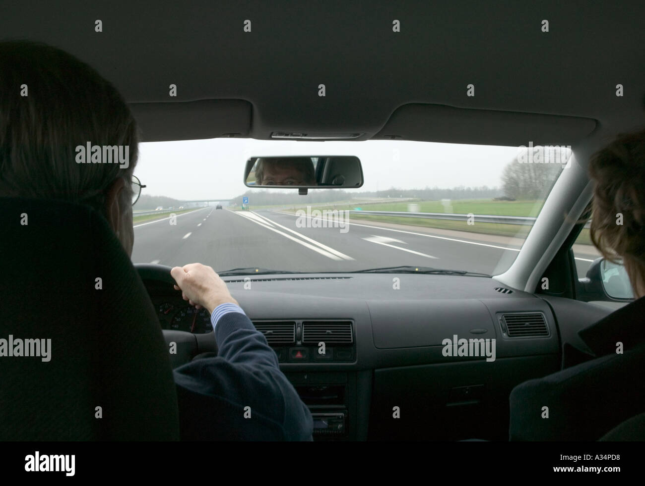 Couple driving car Stock Photo - Alamy