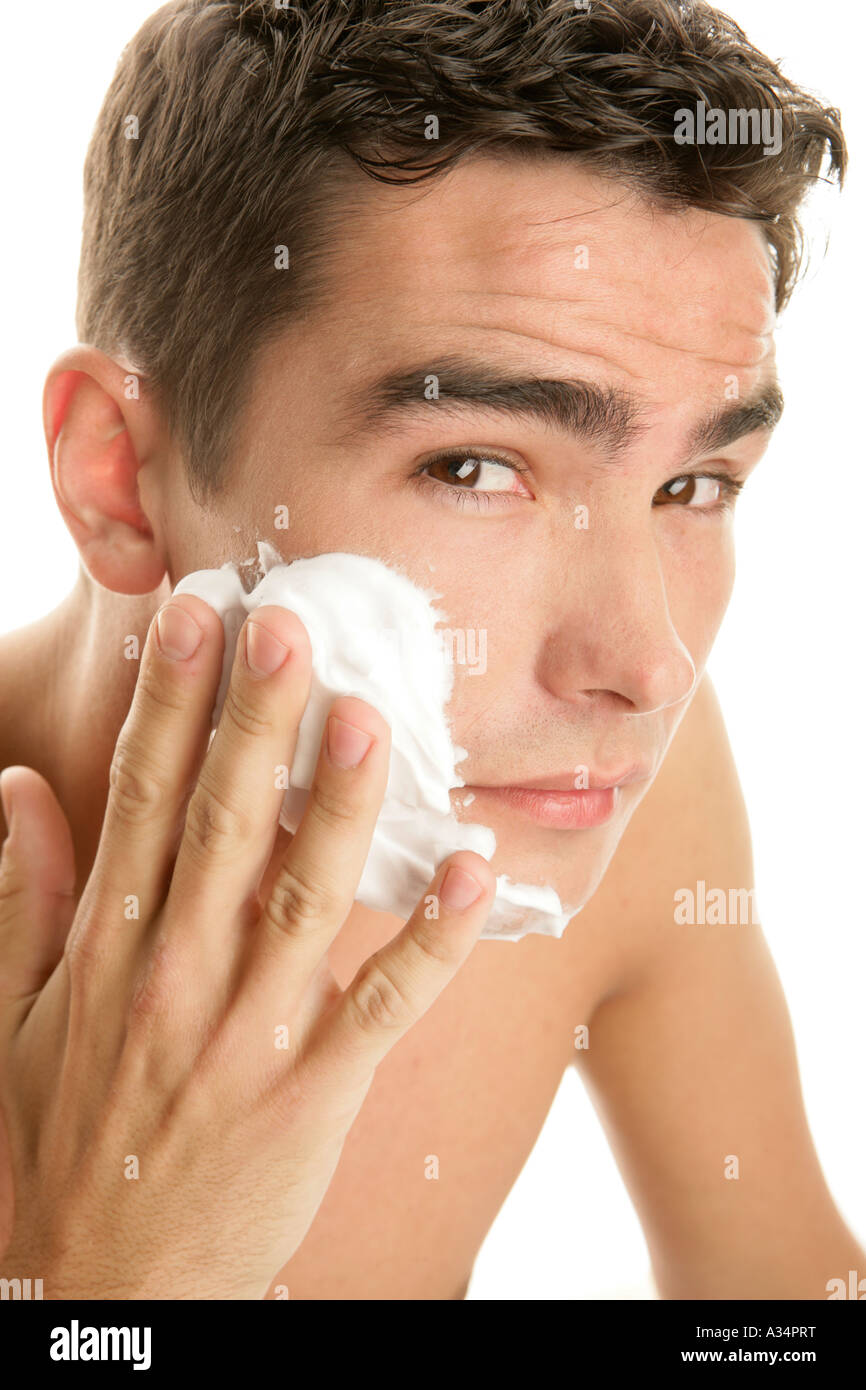 Man applying shaving cream to face Stock Photo - Alamy