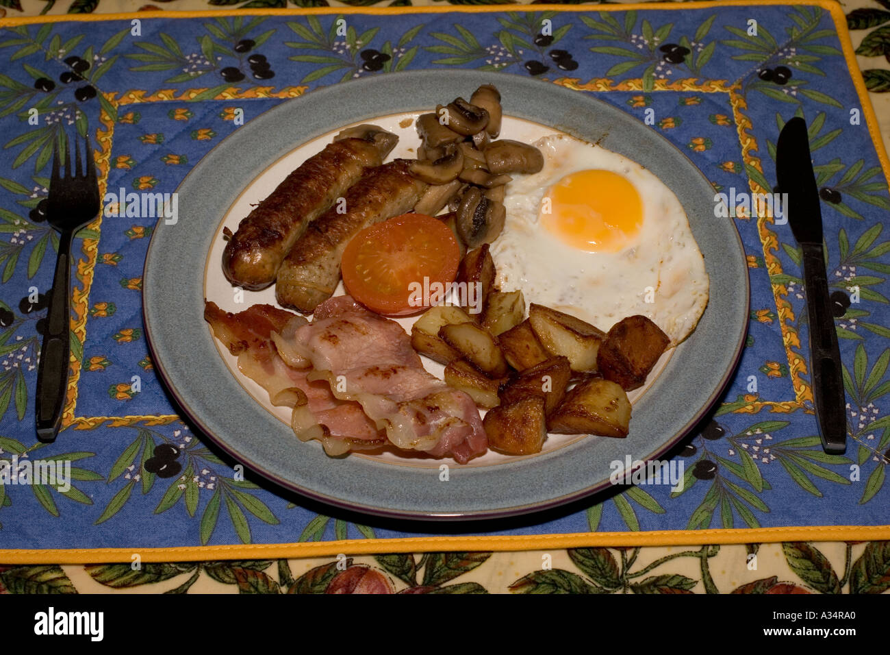 Big English cooked breakfast ready to eat bacon sausages eggs tomato ...