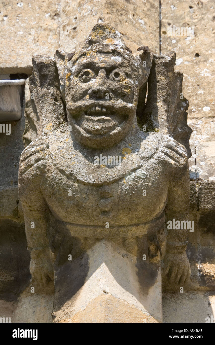 Weathered gargoyle eroded by acid rain St Peters Church Winchcombe UK ...
