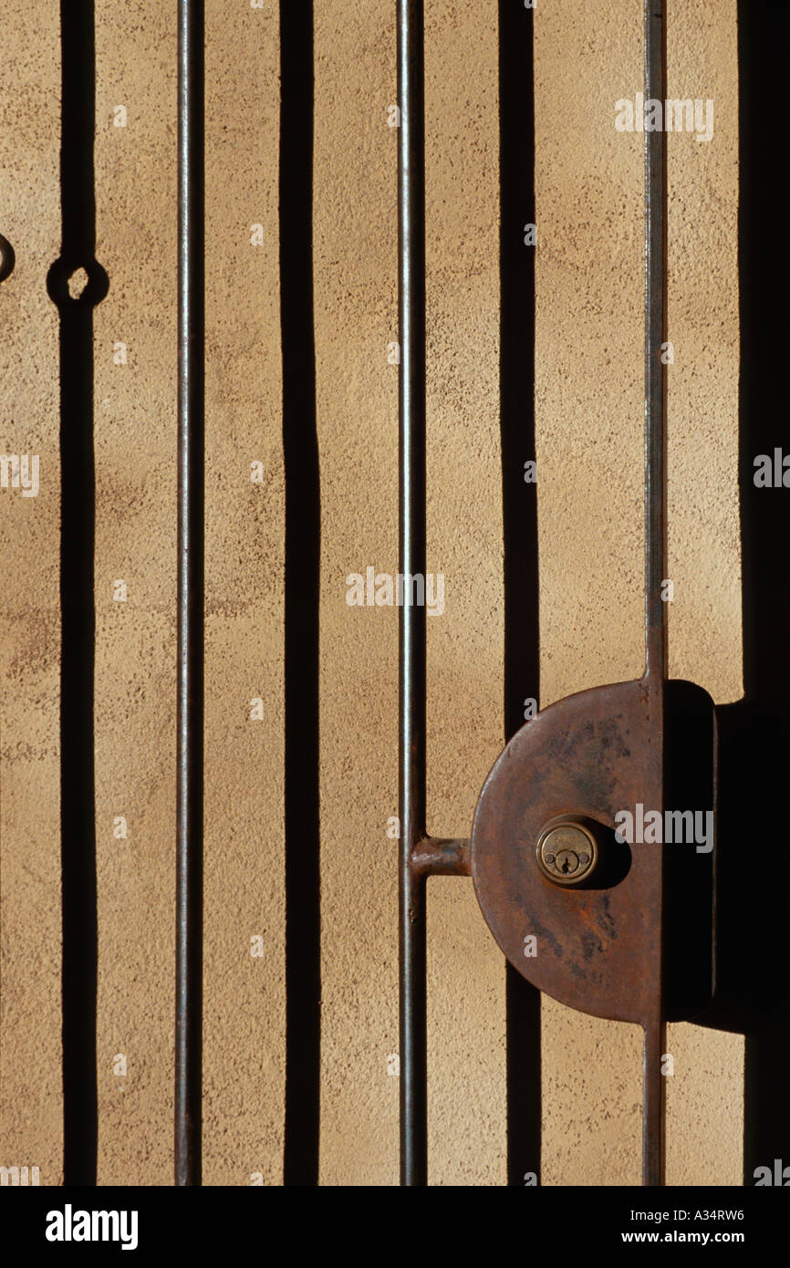 Bars of Metal Entrance Gate Cast Shadow On Adobe Wall Old Town Taos New ...