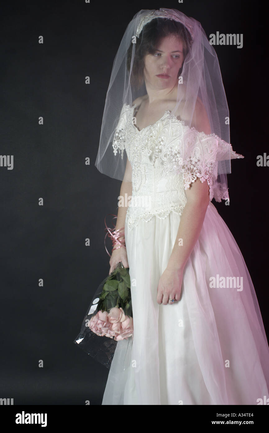 jilted bride in white dress with cheap pink rosebuds Stock Photo - Alamy