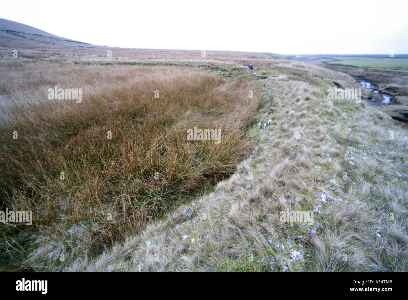 Embankment to the remains of a lodge used to provide power for Cheesden ...