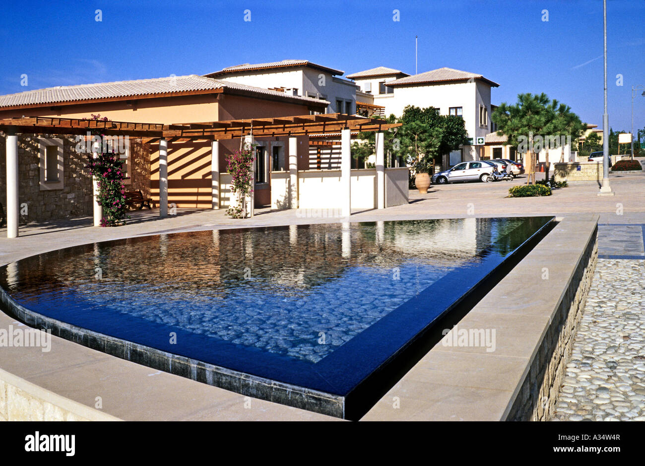 A semi-circular formal raised pool in the new village of "Aphrodite ...