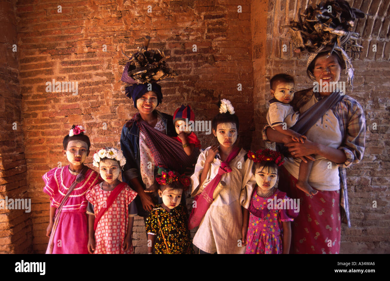 Burmese villagers wearing sandalwood paste on their faces Bagan Myanmar ...
