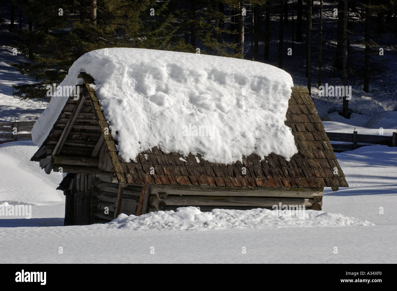 Log cabin buried in snow near Gosau Salzkammergut Austria Stock Photo ...